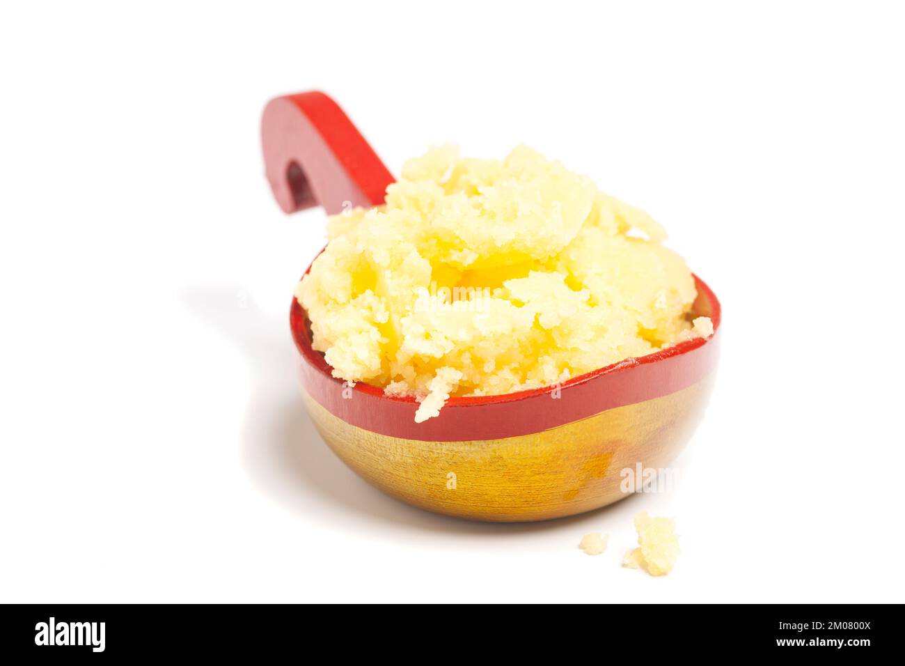 Ghee in wooden spoon isolated on white background Stock Photo - Alamy