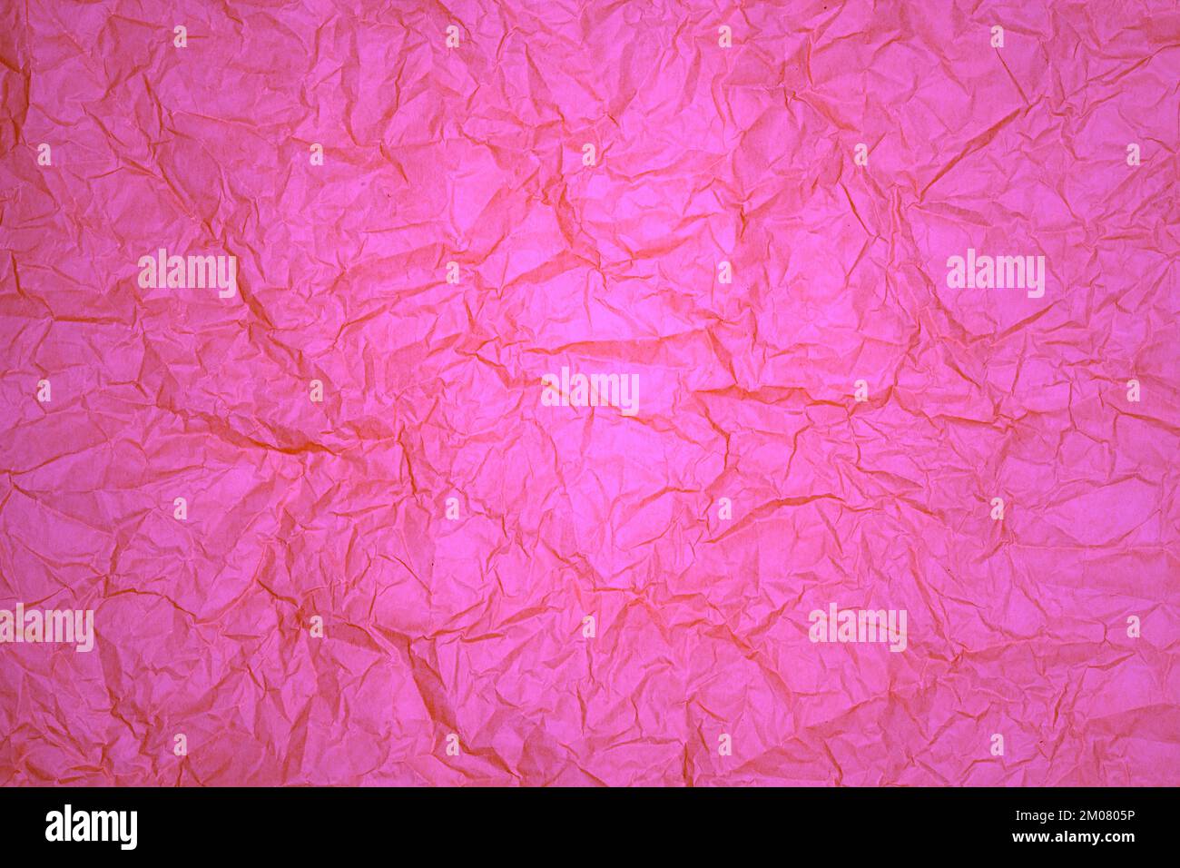Pink crumpled paper texture background Stock Photo - Alamy