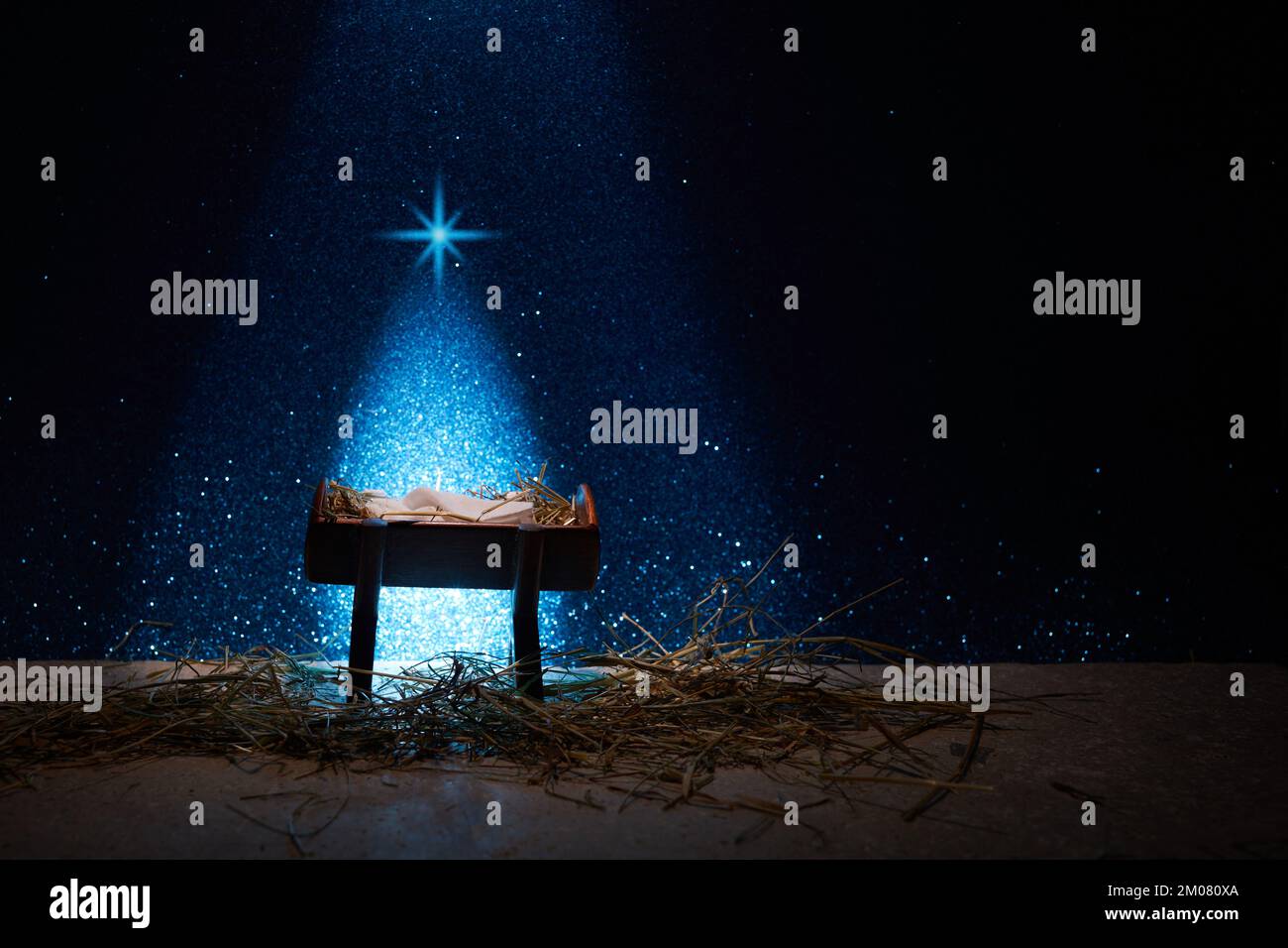 Nativity of Jesus, empty manger at night with bright lights Stock Photo ...