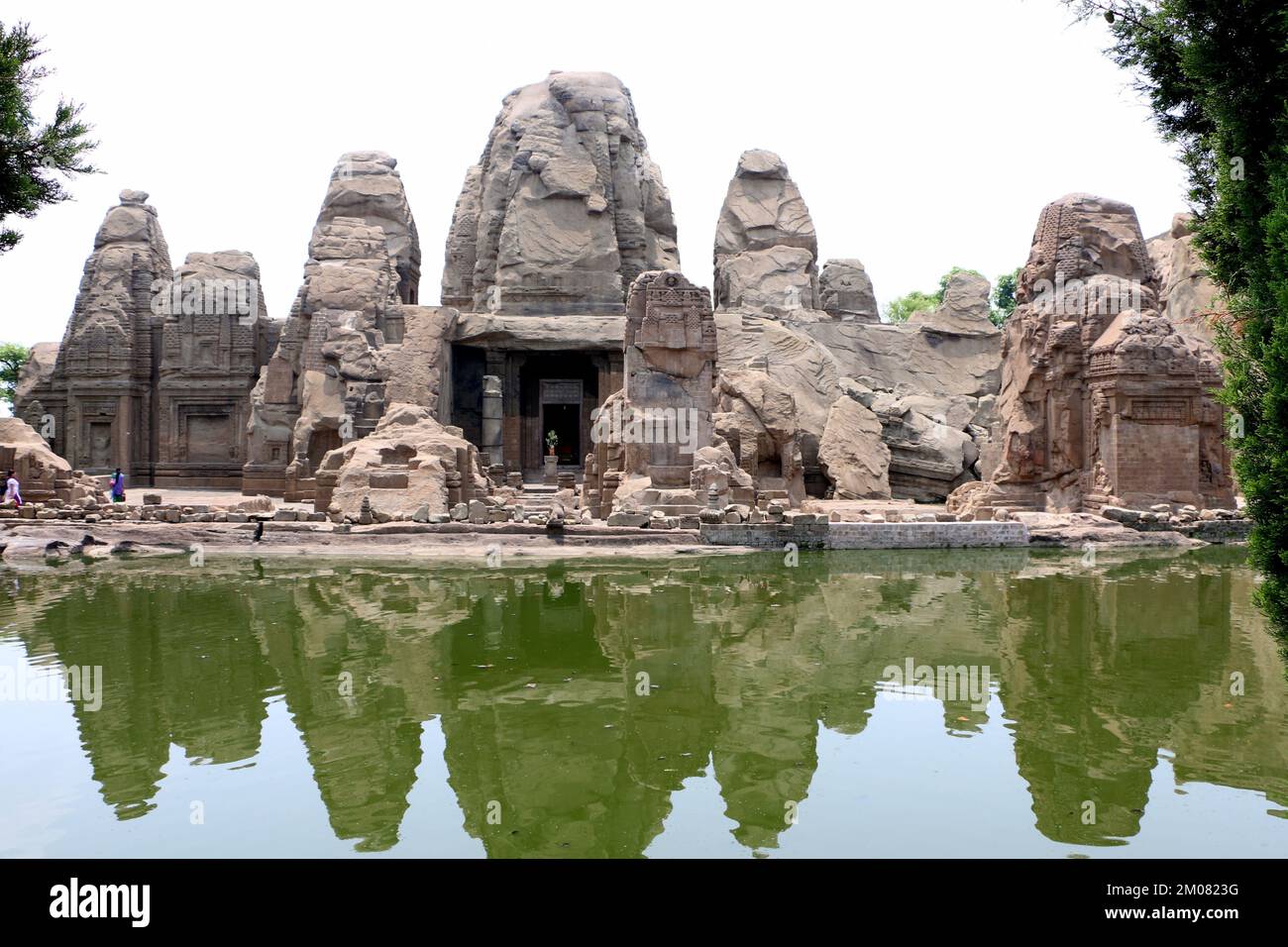The Masrur Temples reflecting on a green pond in Himachal Pradesh ...