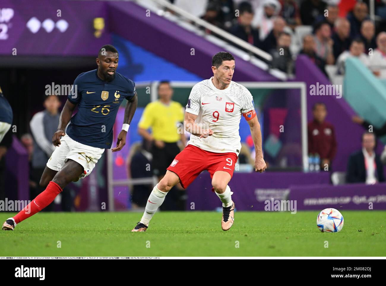 Robert Lewandowski (9) of Poland and Marcus Thuram (26) of France ...