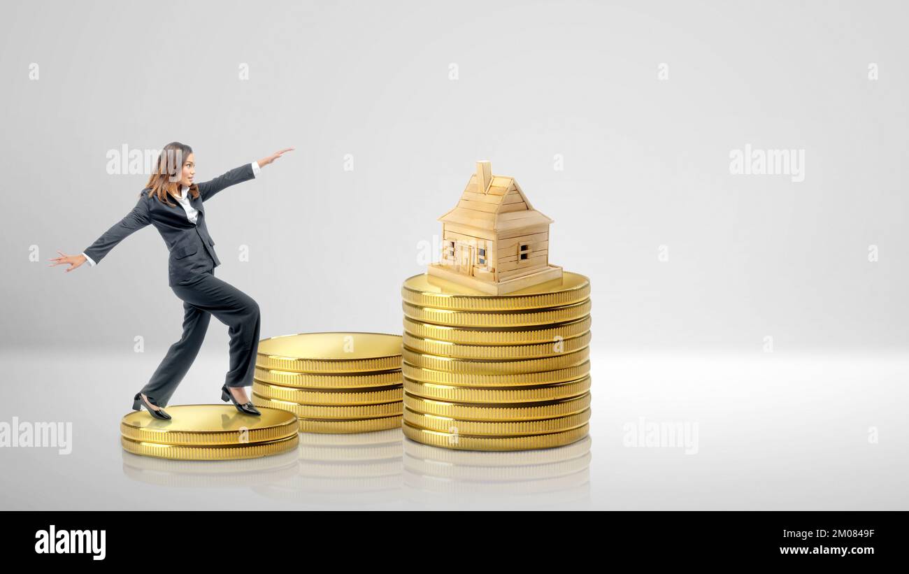 Asian businesswoman climbing coin stairs to get wealth with white ...