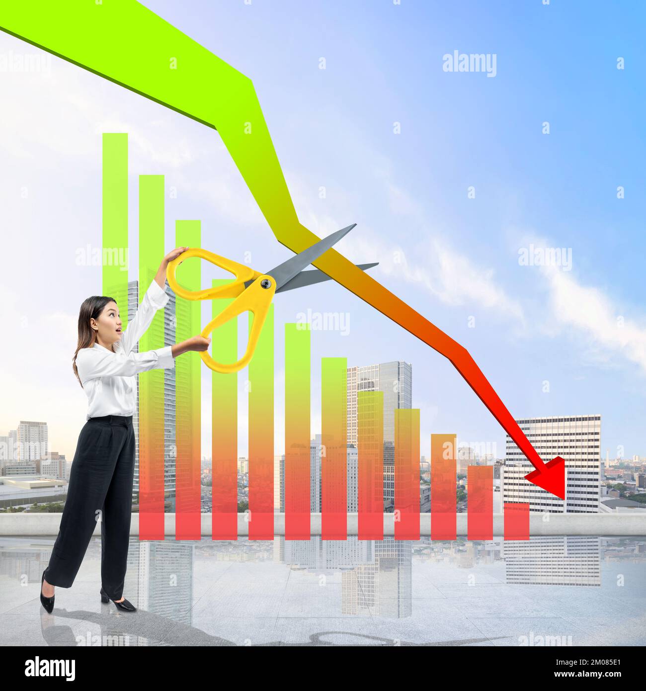 Asian businesswoman holding scissors to cut decrease arrow on the graph with cityscape ...