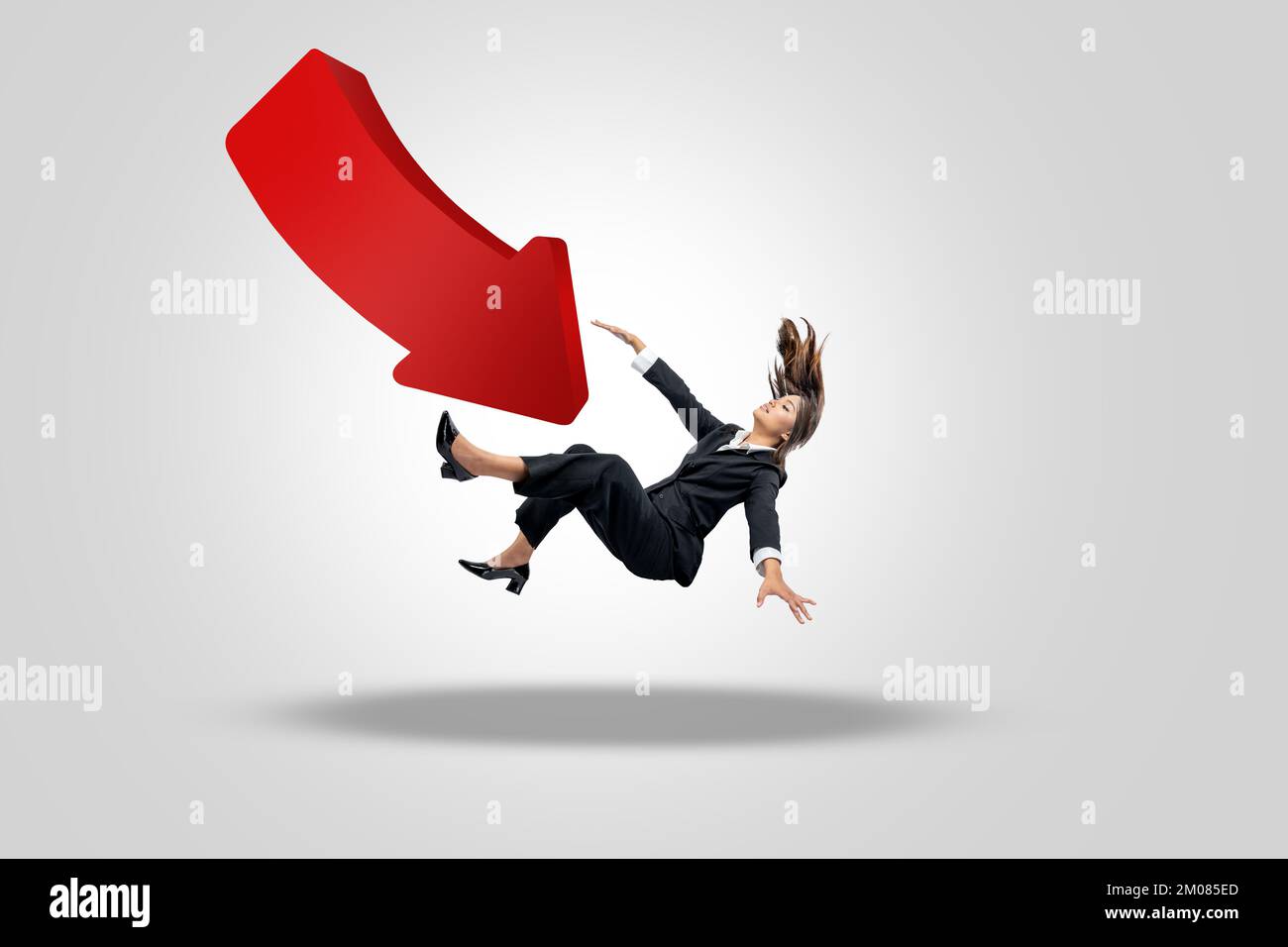 Asian businesswoman falling on down arrow on white background Stock ...