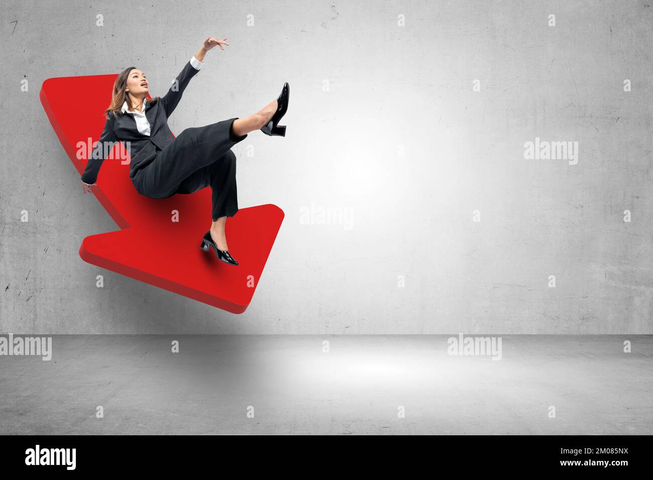 Asian businesswoman falling on down arrow with white wall background ...