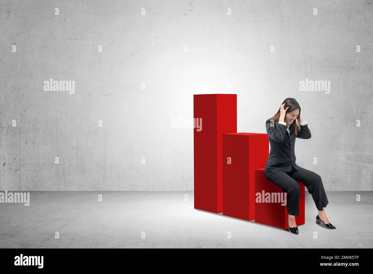 Asian businesswoman sitting on decreasing graph with frustrated ...