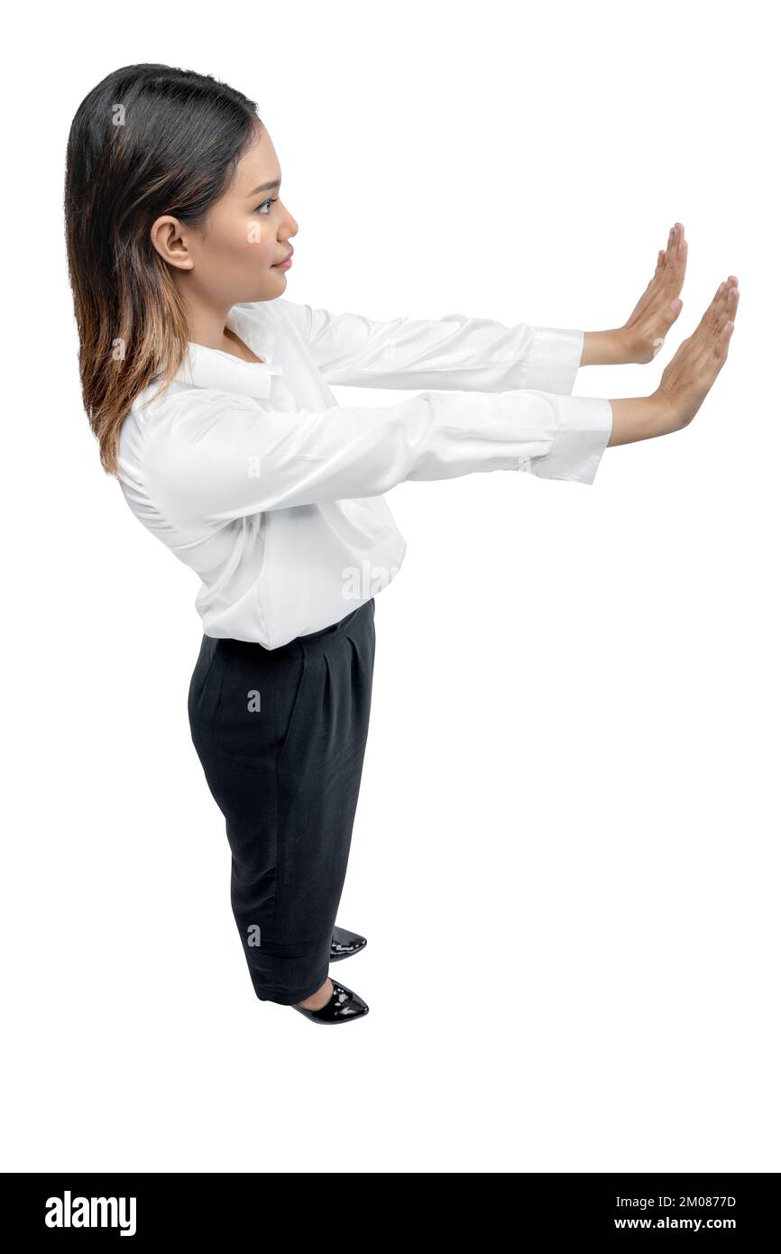 Asian businesswoman pushing something isolated over white background ...