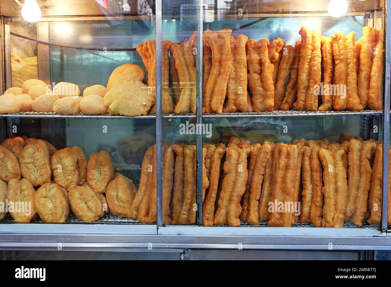 Display shelf of Chinese dough stick shop Stock Photo - Alamy
