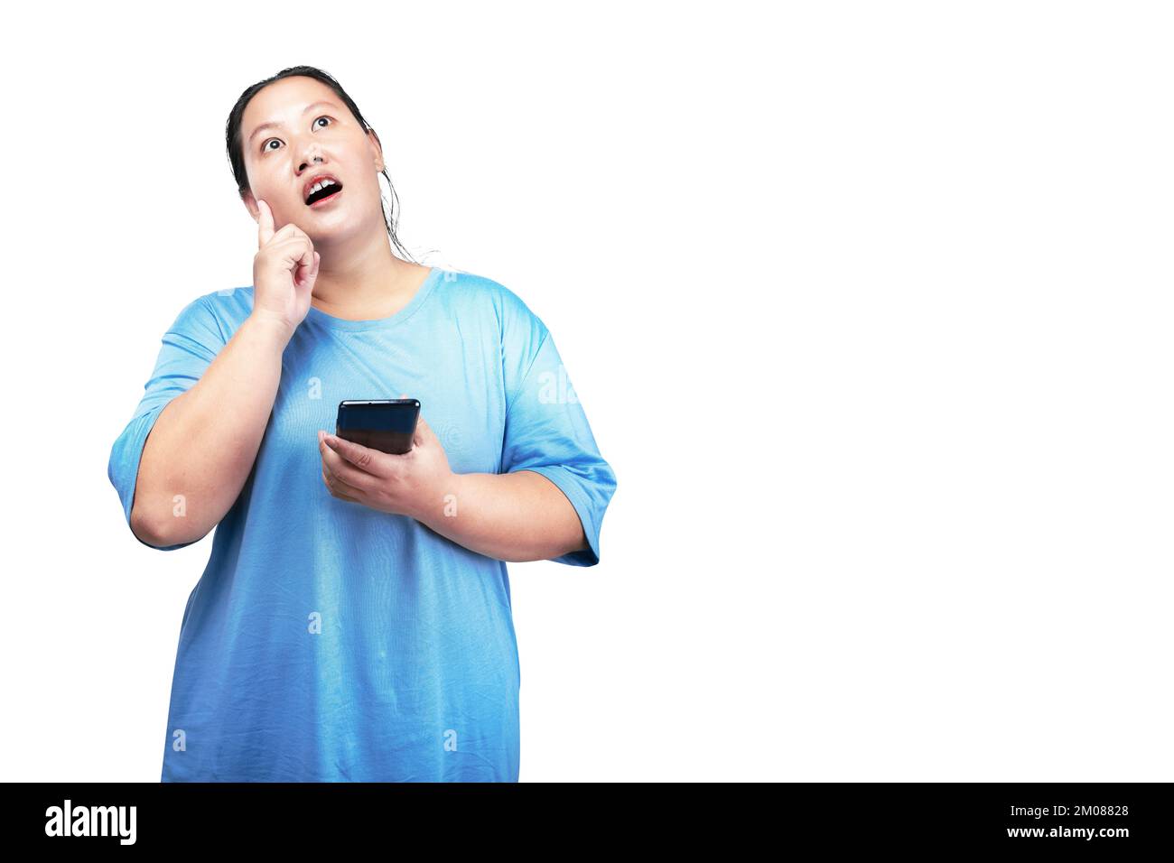 Asian fat overweight woman holding mobile phone while thinking ...