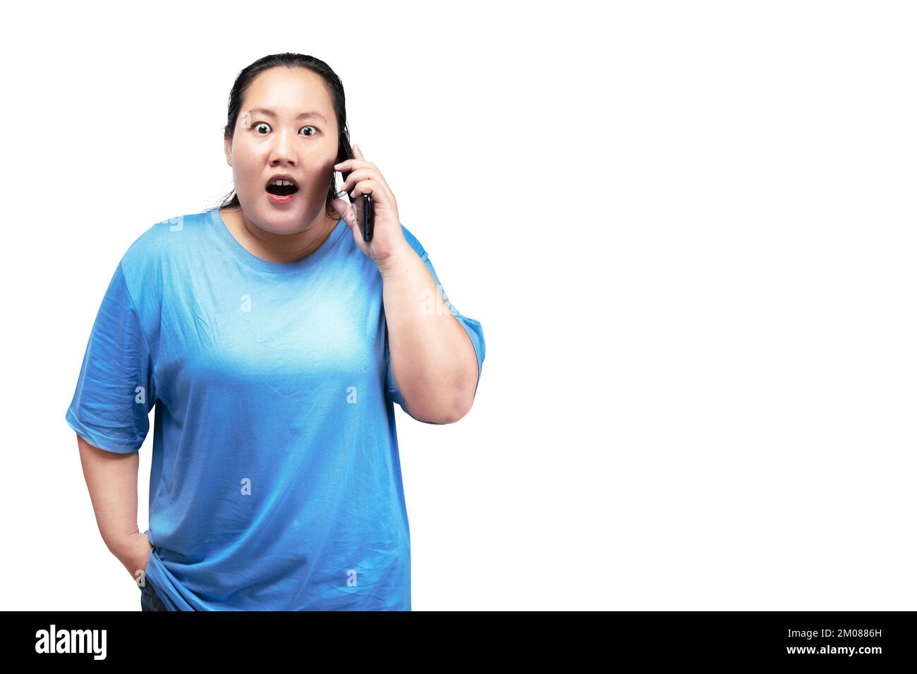 Asian fat overweight woman holding mobile phone isolated over white ...