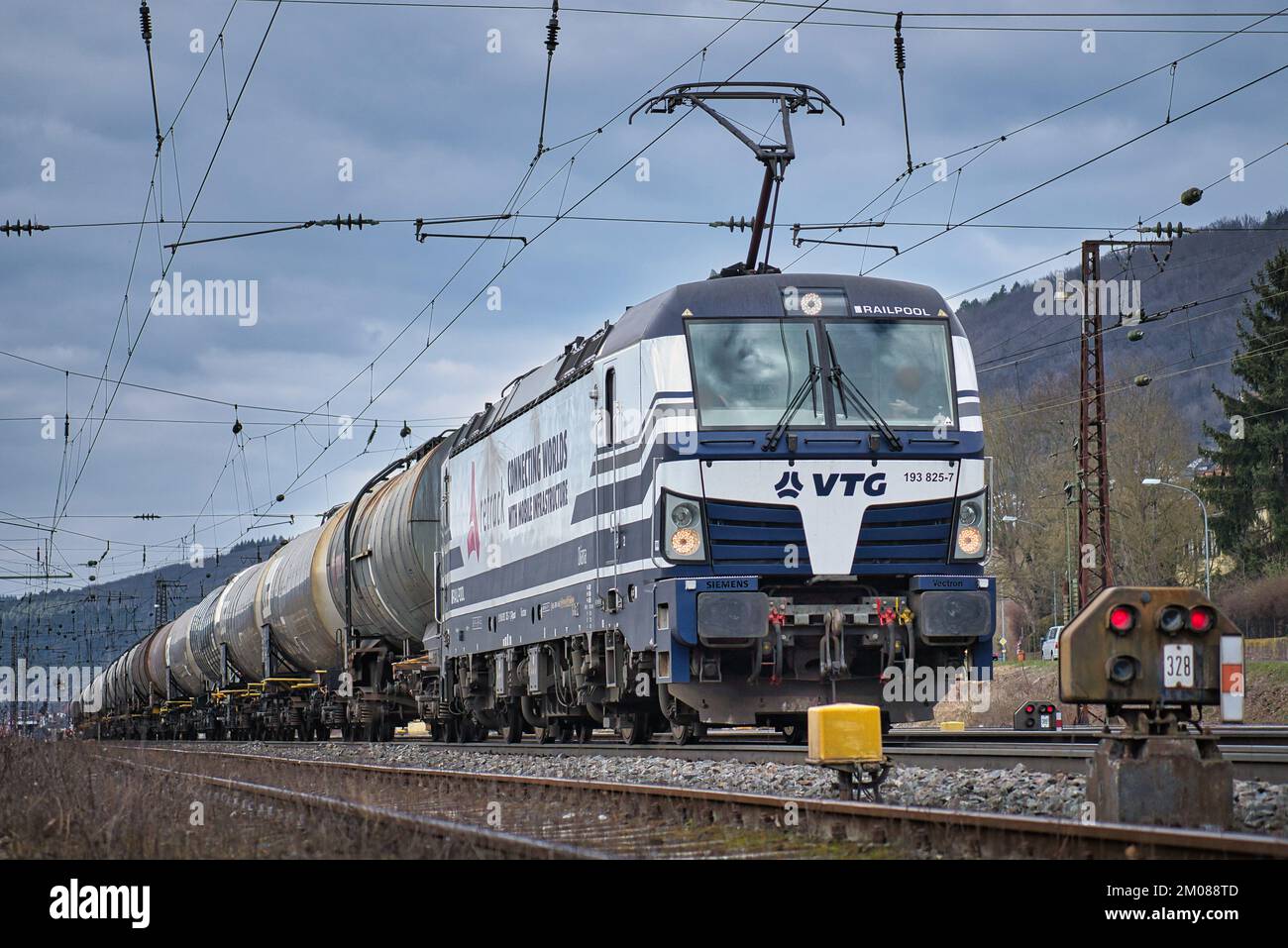 A Siemens Vectorn AC 193 train on the railway with mountains in the background on a gloomy day ...