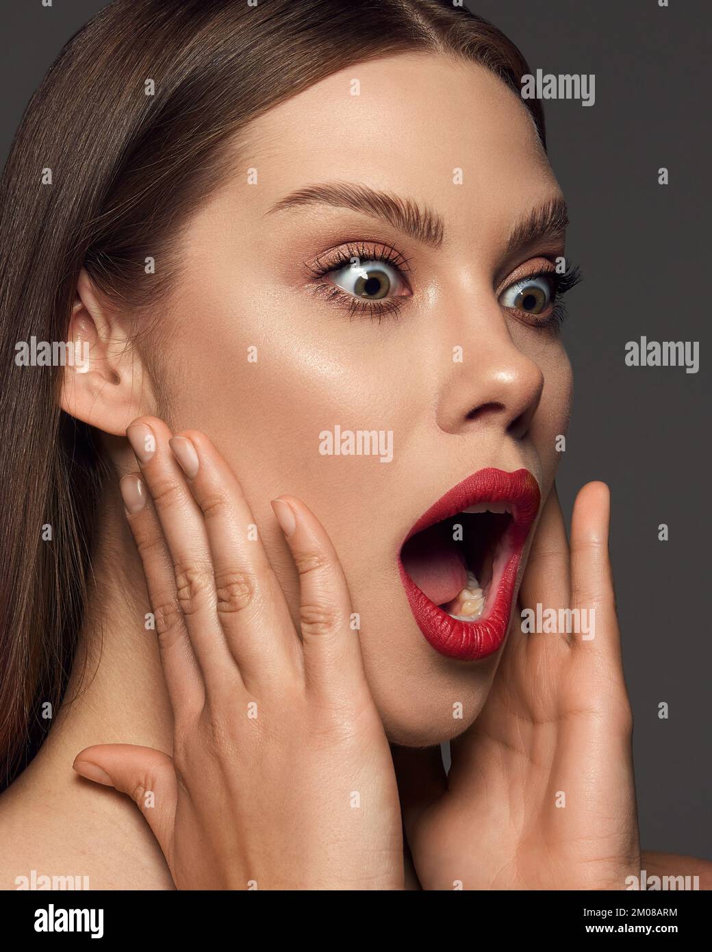 Close-up portrait of emotive beautiful young woman with trendy makeup ...