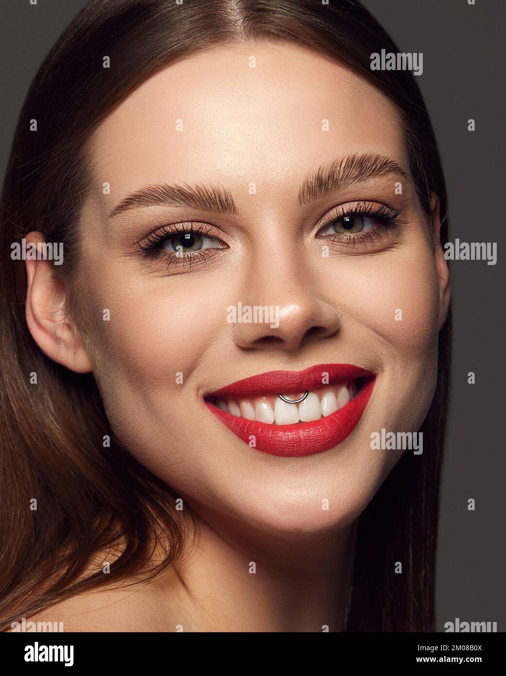 Close-up portrait of emotive beautiful young woman with green eyes ...