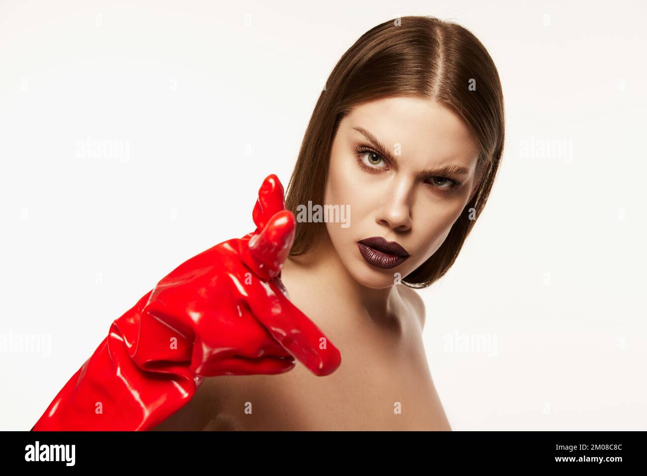 Portrait of beautiful young woman with straight brown hair and dark ...