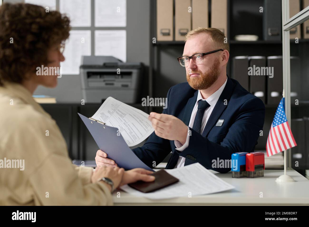 Portrait of bearded male consultant working in US embassy office and ...