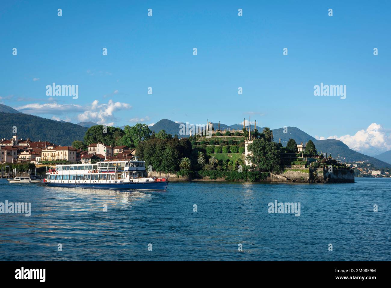 Lake Maggiore Italy, view in summer of a ferry boat passing Isola Bella ...