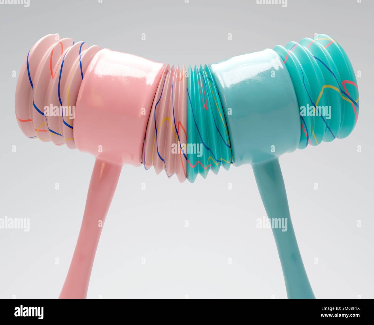 Two opposing plastic childrens squeaking hammers striking each other on ...