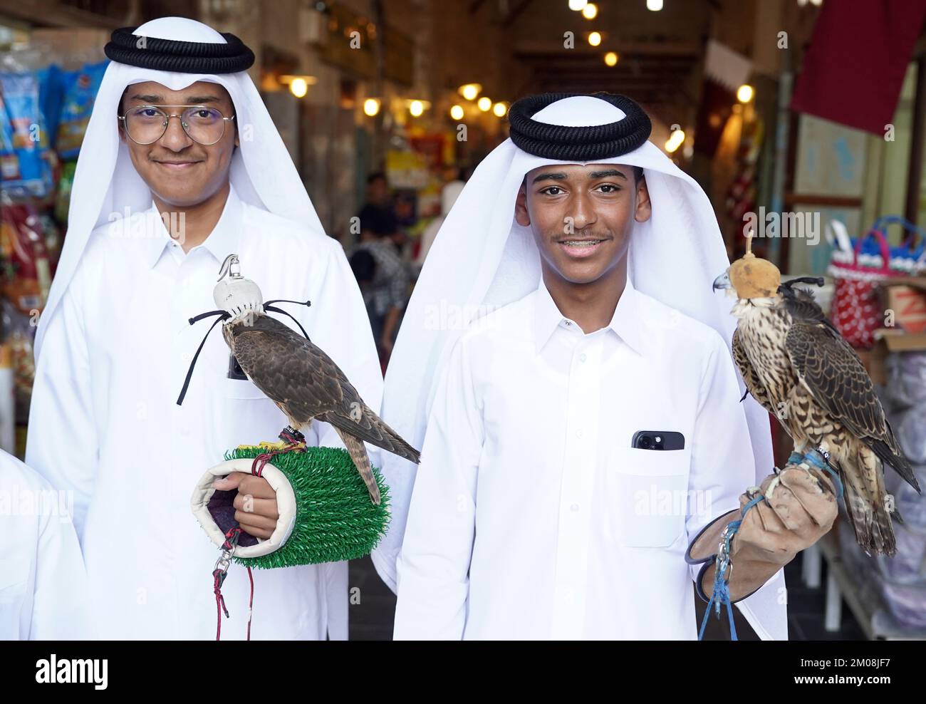Local residents with birds of prey in the Souq area of Doha. Picture ...