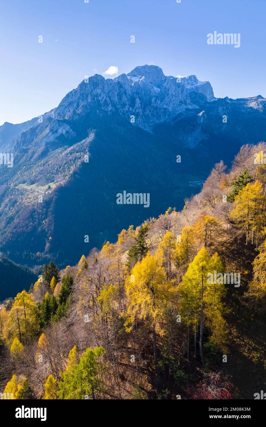 Aerial view of a small hut in Azzone in front of the Presolana massif ...