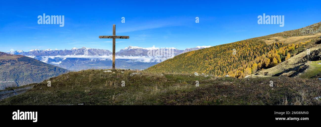 Mountain cross, view of the Lower Valais with autumn forest, Alpage de ...