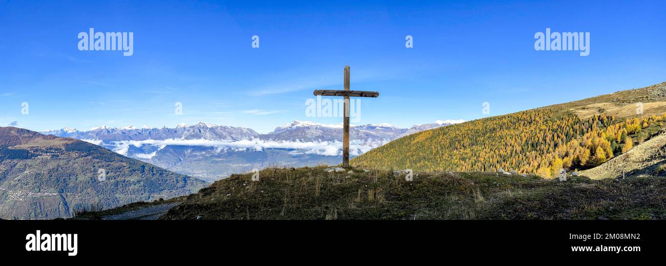 Mountain cross, view of the Lower Valais with autumn forest, Alpage de ...