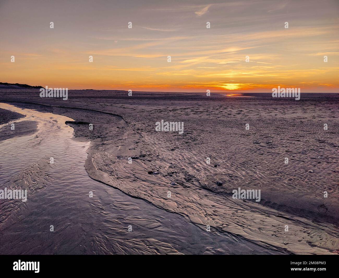 An aerial drone view of Baie de Somme large estuary in France at golden ...