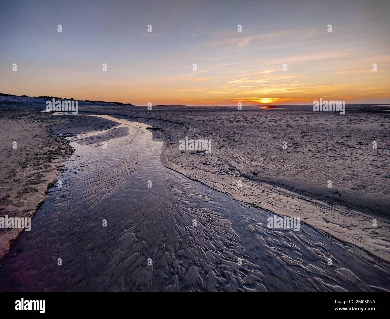 An aerial drone view of Baie de Somme large estuary in France at golden ...