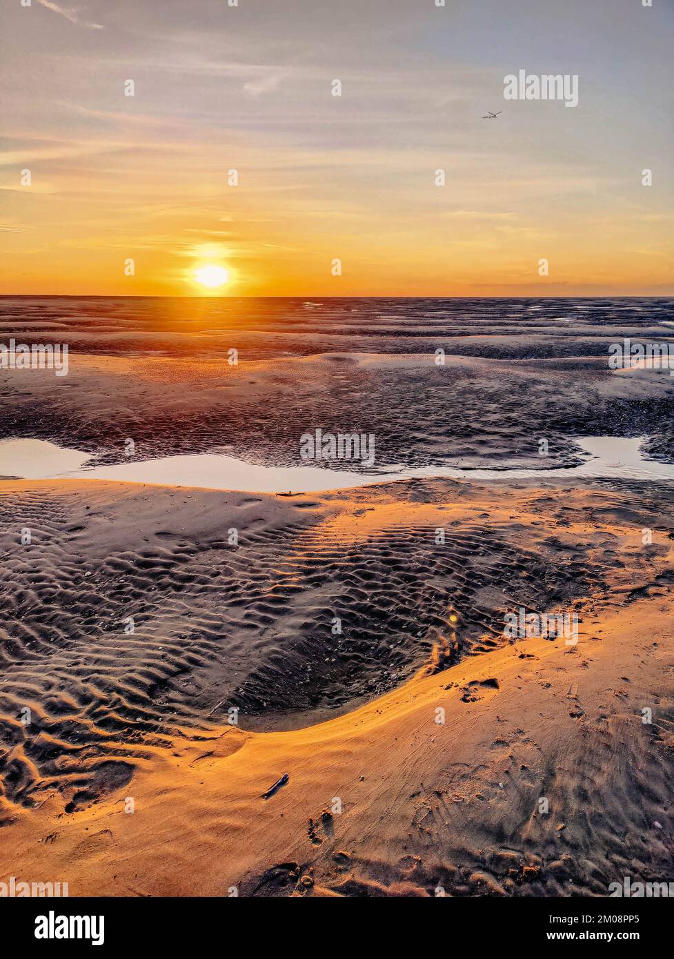 An aerial drone view of Baie de Somme large estuary in France at golden ...