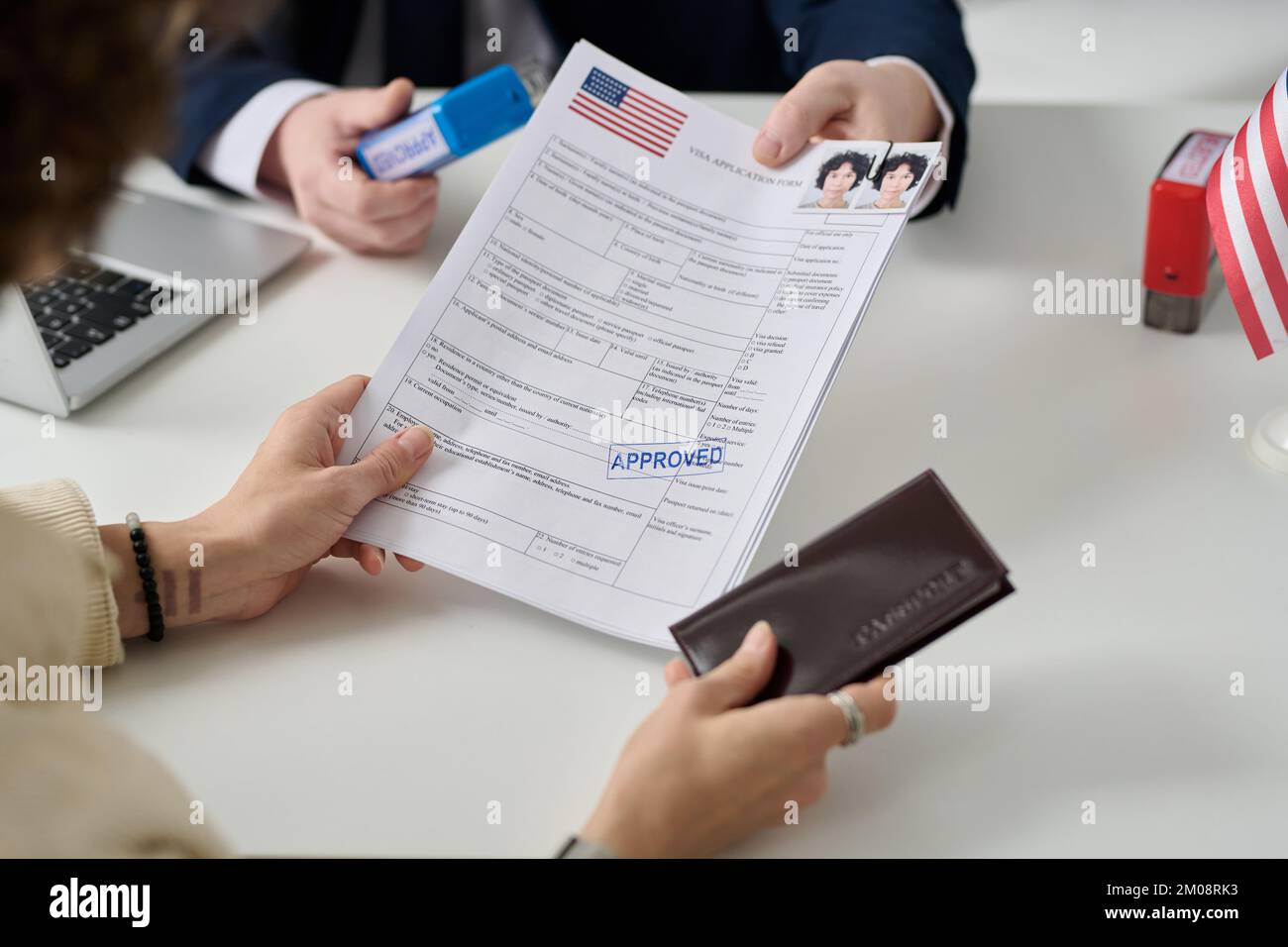 Close up of woman getting US visa in immigration office and holding ...