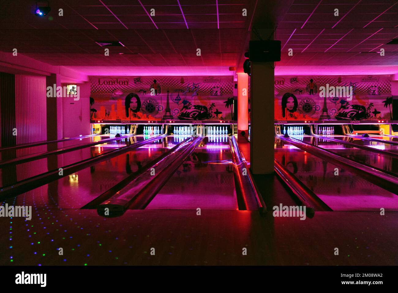 Colourfully illuminated bowling alley, bowling centre, interior ...