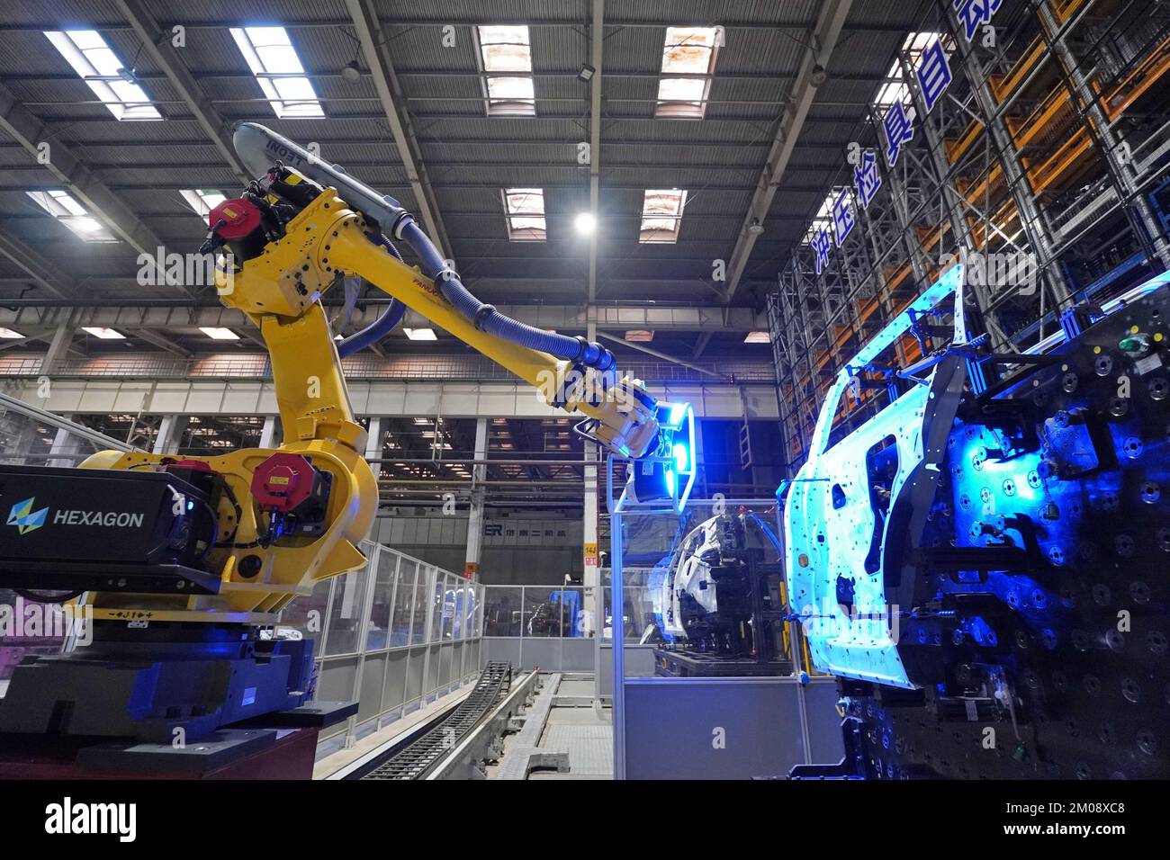 YANTAI, CHINA - NOVEMBER 17, 2022 - Industrial robots make auto parts ...