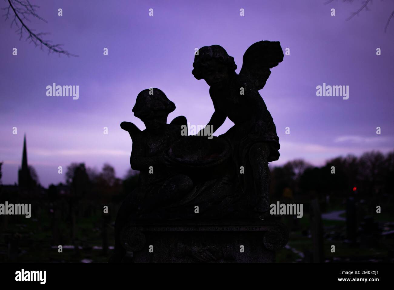 Fallen Angels statue silhouette Stock Photo - Alamy