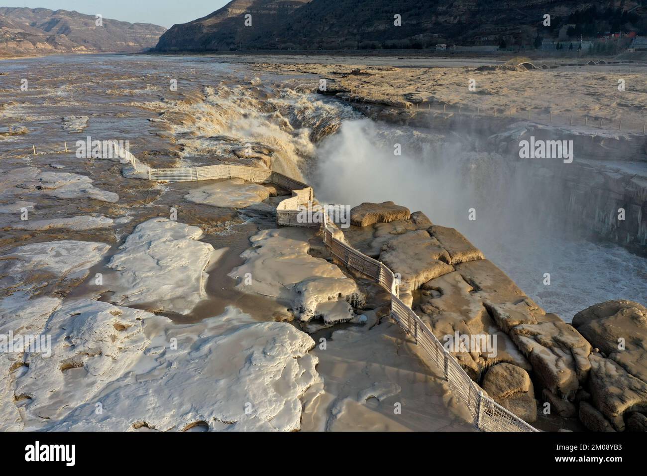 Aerial photos show the hanging ice scenery of Hukou Waterfall of the ...