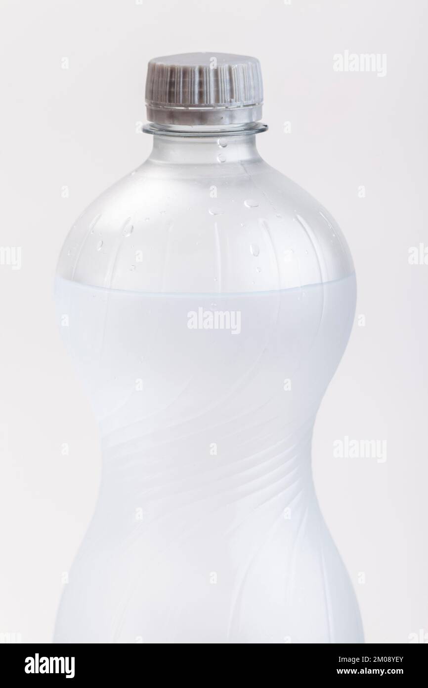 A full plastic bottle of water on a white background Stock Photo - Alamy