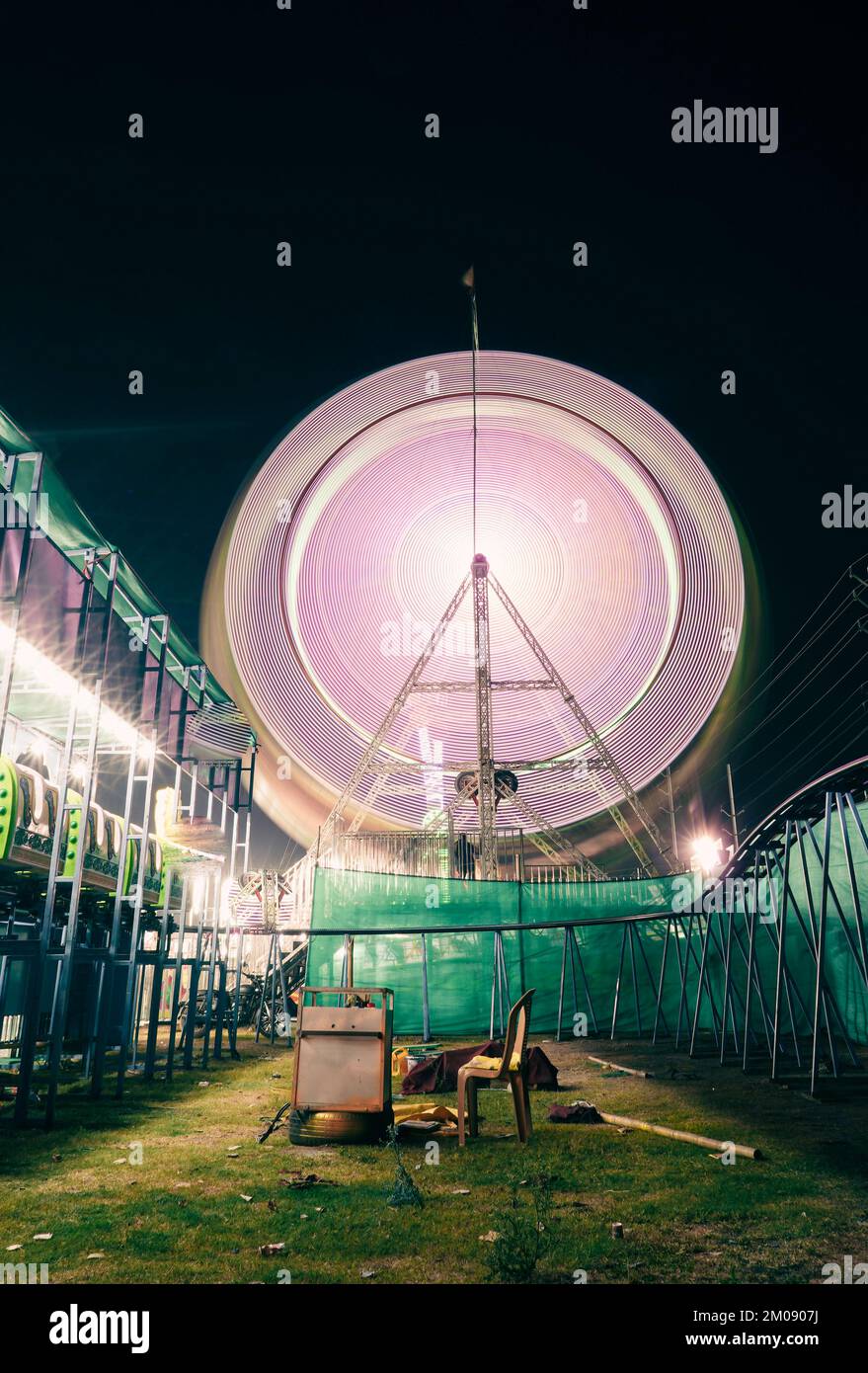 Long Exposure slow shutter speed Shot of a Spinning Ferris Wheel with ...