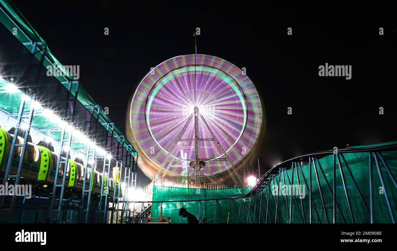 Long Exposure slow shutter speed Shot of a Spinning Ferris Wheel with ...