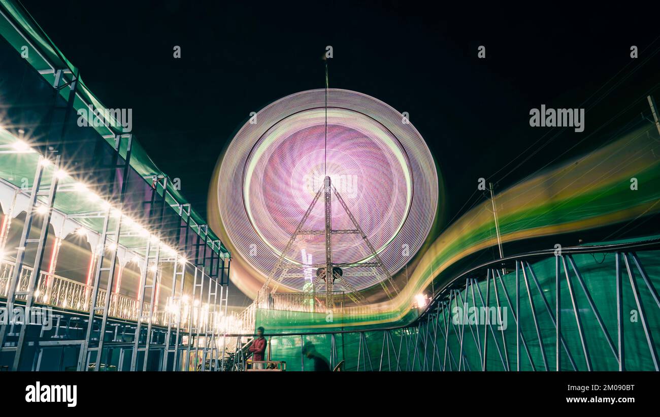 Long Exposure slow shutter speed Shot of a Spinning Ferris Wheel with ...