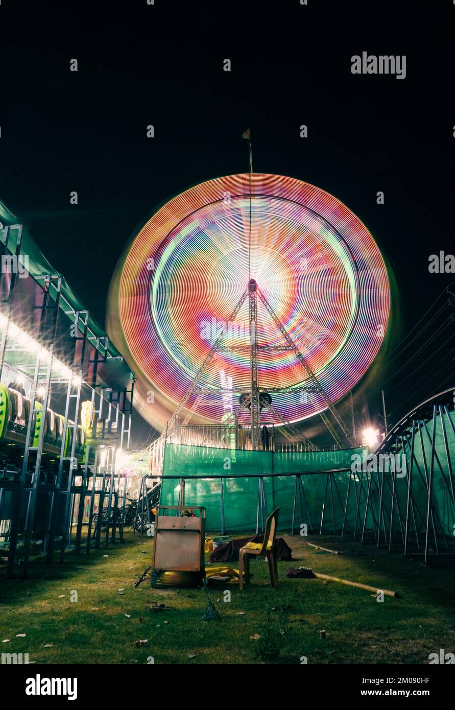 Long Exposure slow shutter speed Shot of a Spinning Ferris Wheel with ...
