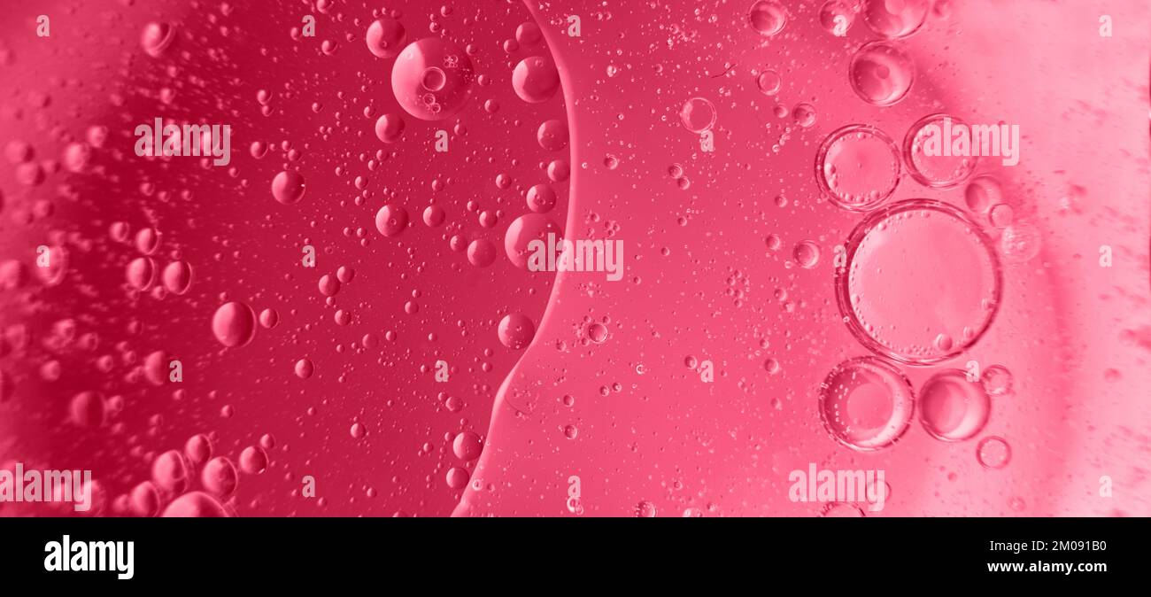 abstract light viva magenta background with oil circles . bubbles of ...