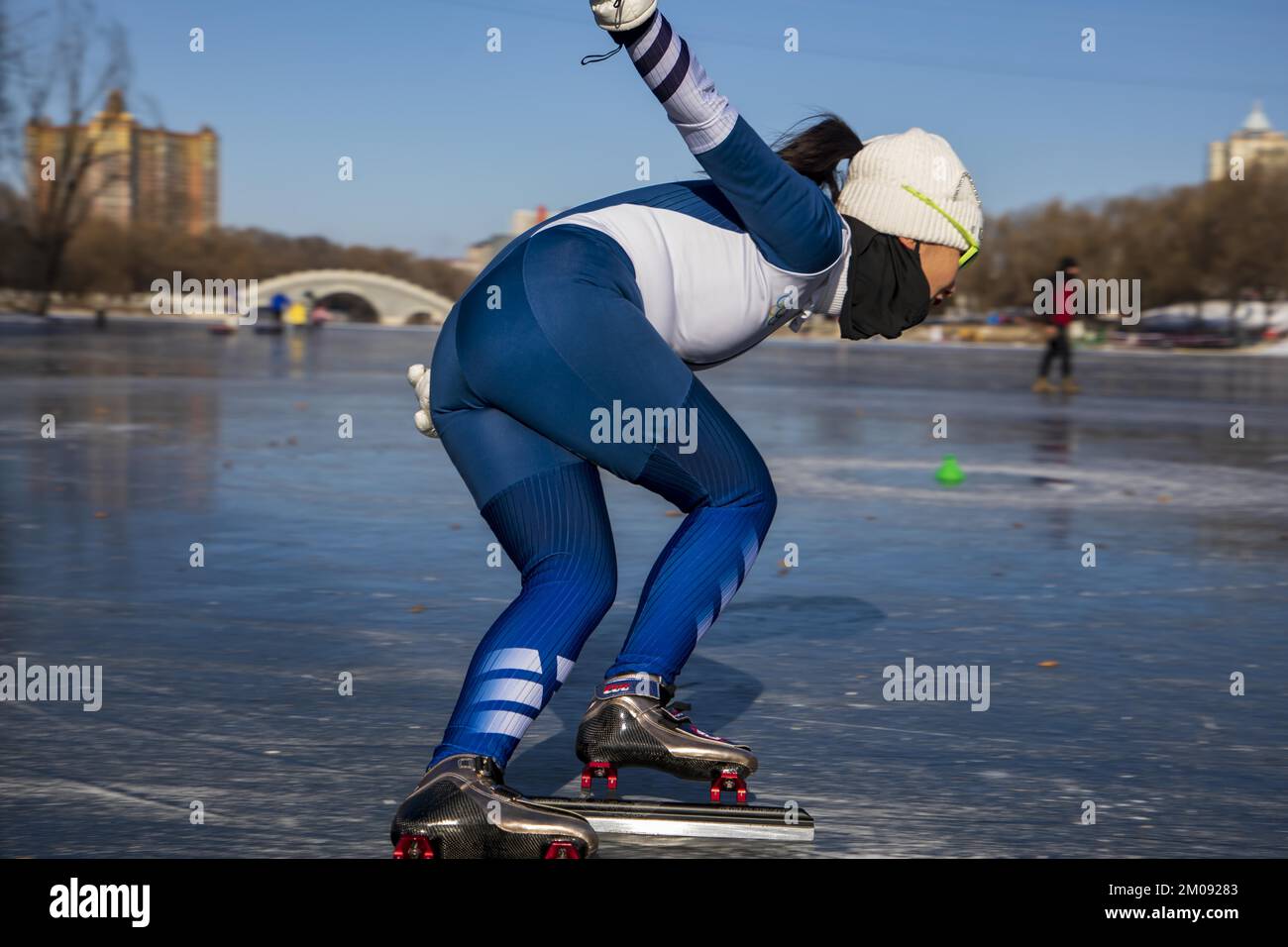 Citizens are ice-skating on the lake in Jiangbin Park in Jilin City ...