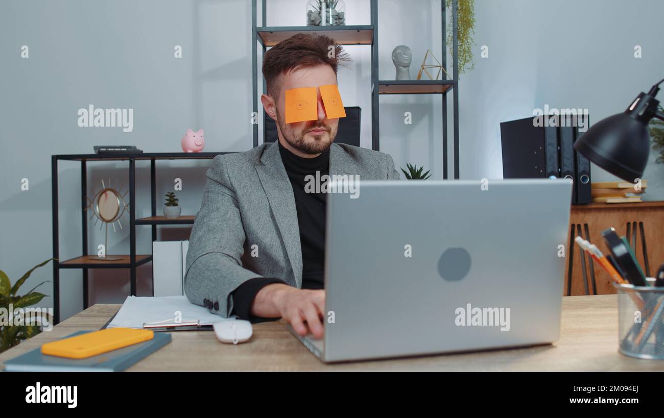 Inefficient tired businessman in suit working sleeping on laptop ...