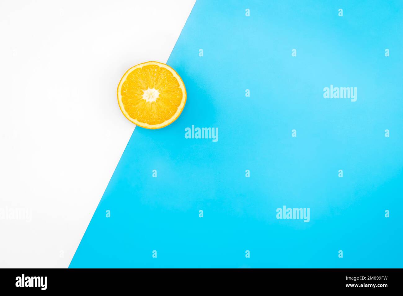 Orange on a colored background, conceptual minimalism, flat lay Stock ...