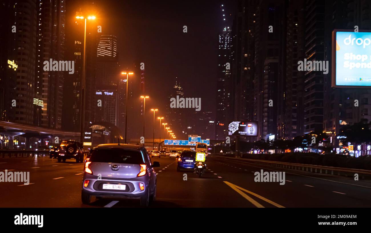 Dubai city in the night, road traffic in the night, high rise buildings ...