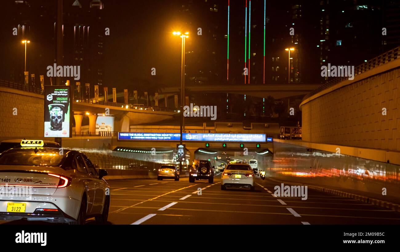 Dubai city in the night, road traffic in the night, high rise buildings ...