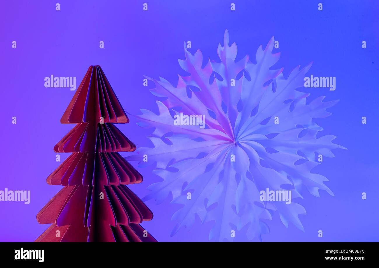 Paper Christmas tree and snowflake on neon gradient background Stock ...
