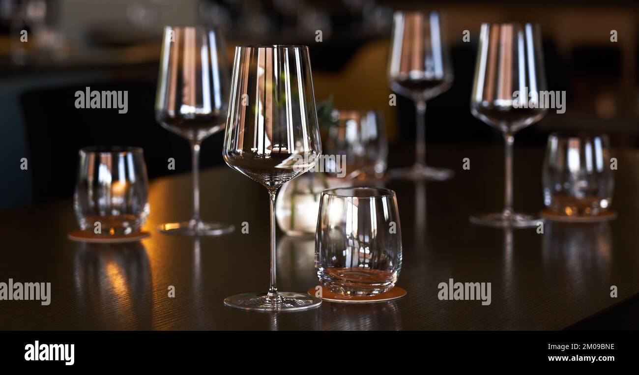 Empty wineglasses waiting on restaurant table Stock Photo - Alamy