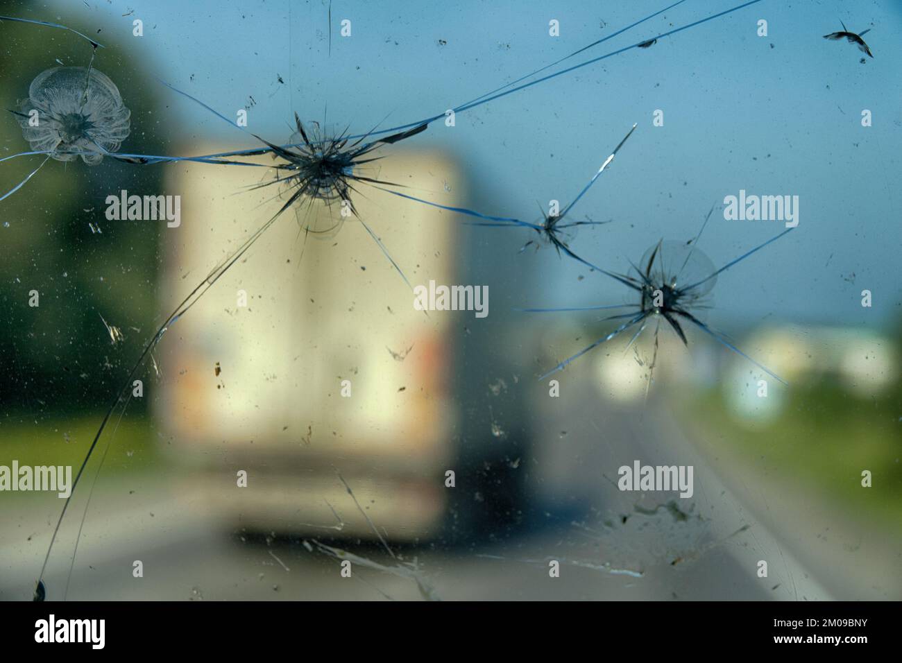 Highway through a broken windshield after encountering a truck with ...