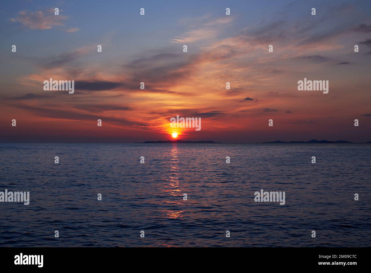 Sunset or sunrise over the sea, Seascape with ocean, cloudy sky and ...