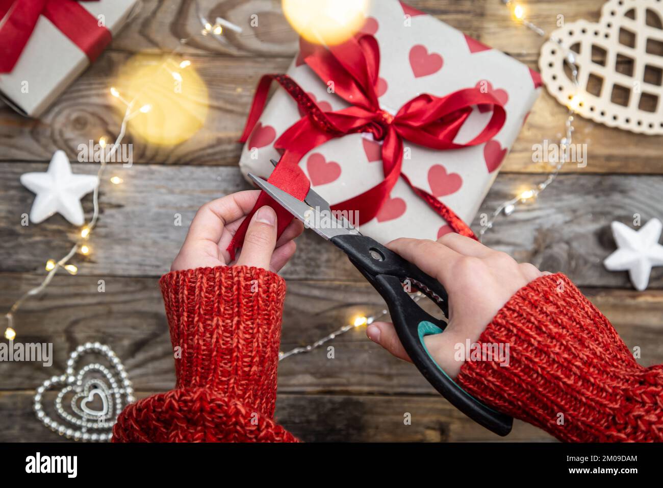 Valentine's Day gift on a wooden background with decor details, top ...