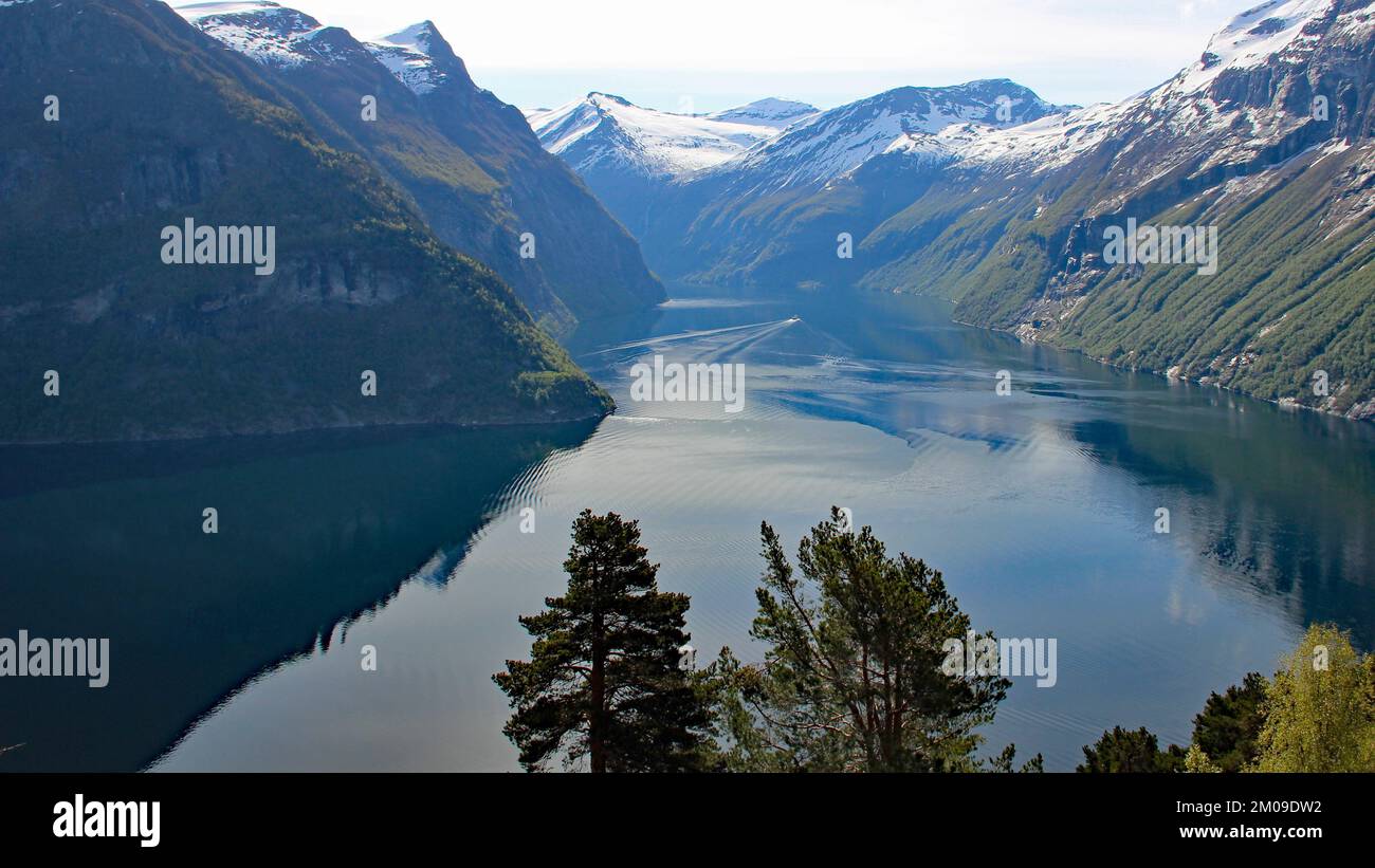 View of the water surface of the fjord and the surrounding mountain ...